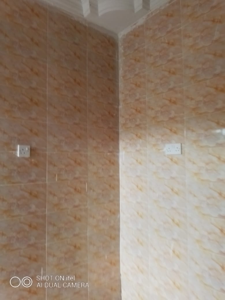 Ollam Tiles Installation and flooring concept - Construct Ng